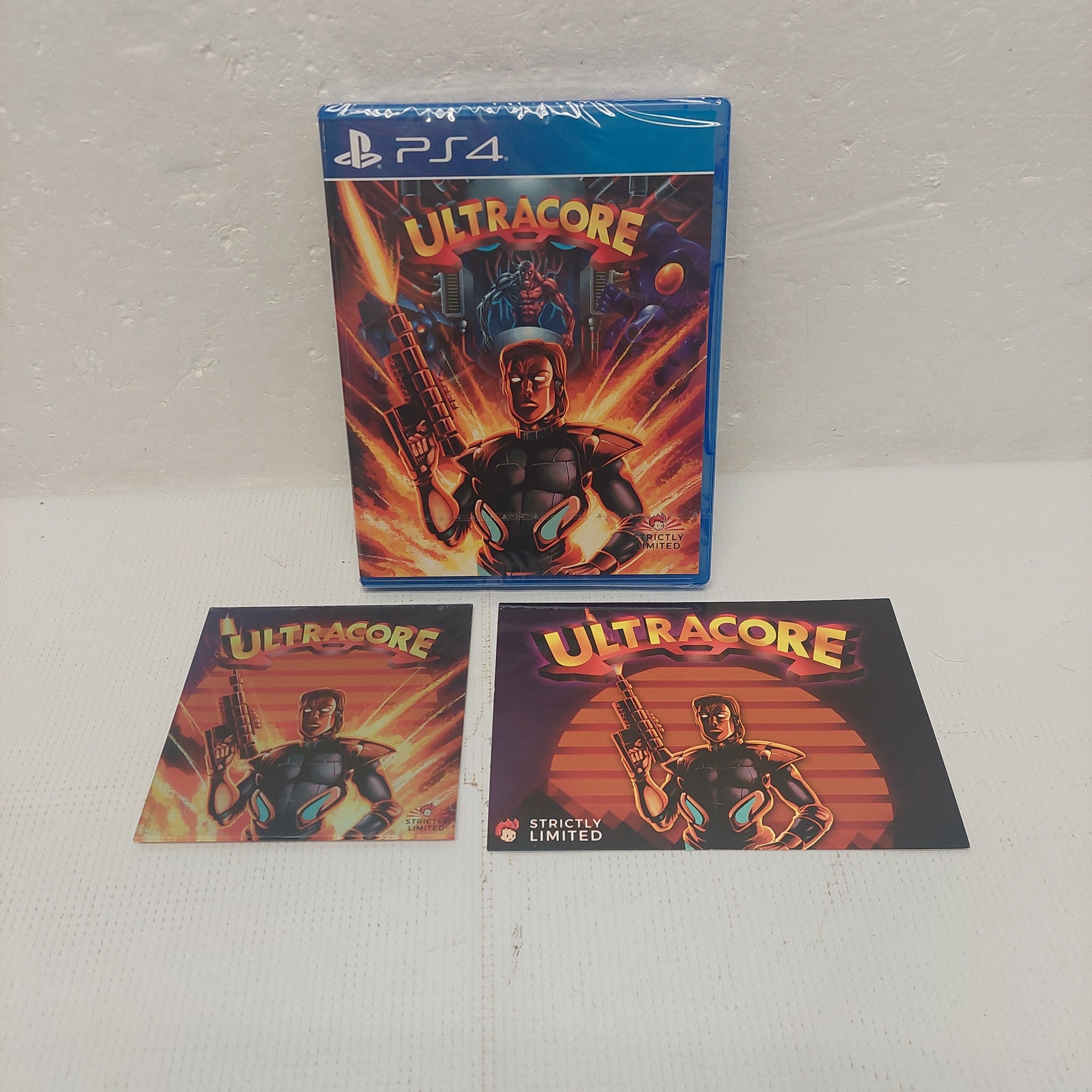 Lot of PS4 Ultracore Game, Mini Plaque and Postcard – Retro Madness